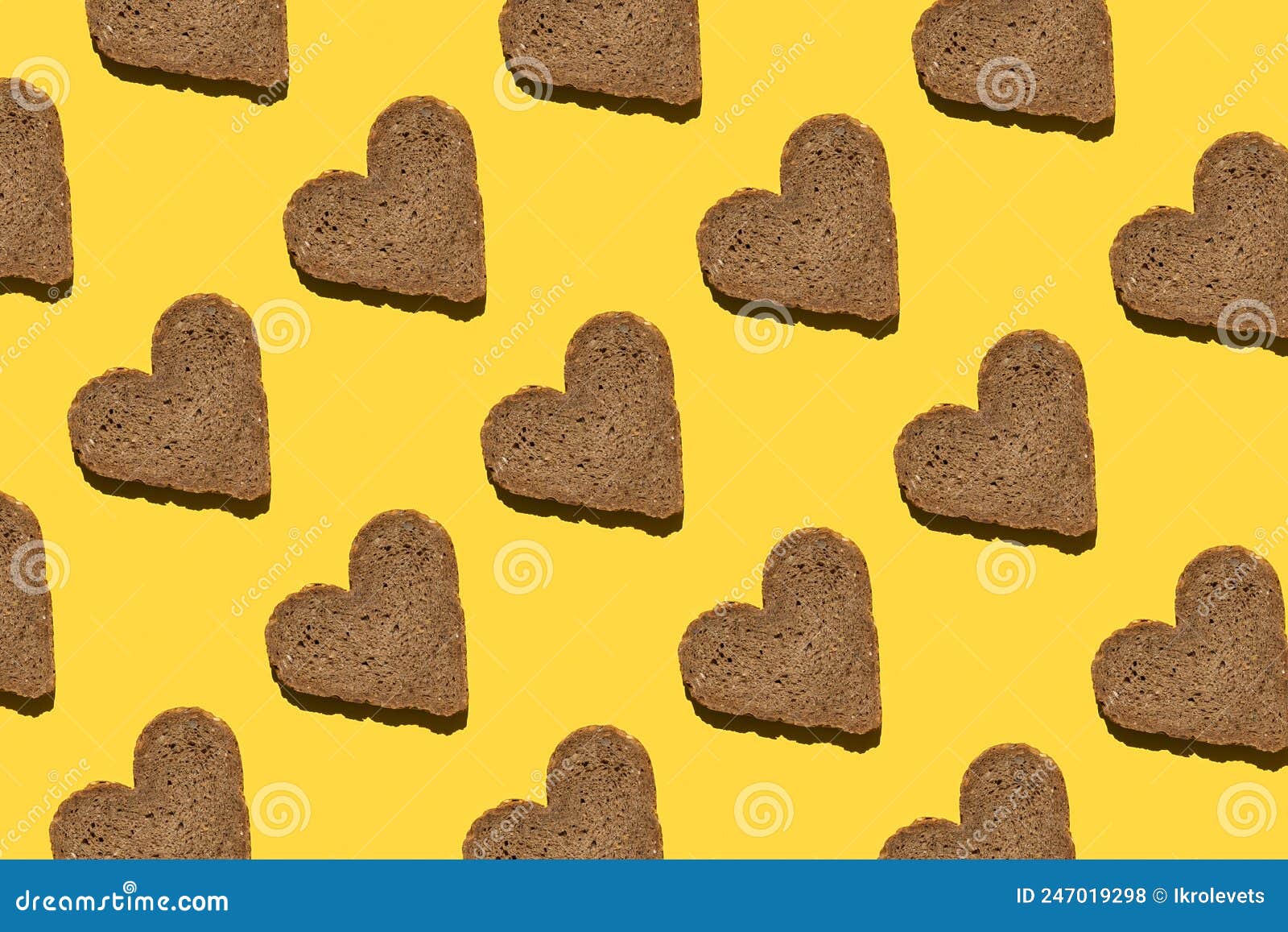Pattern Made with Bread in Heart Form on Yellow Background, As Backdrop ...