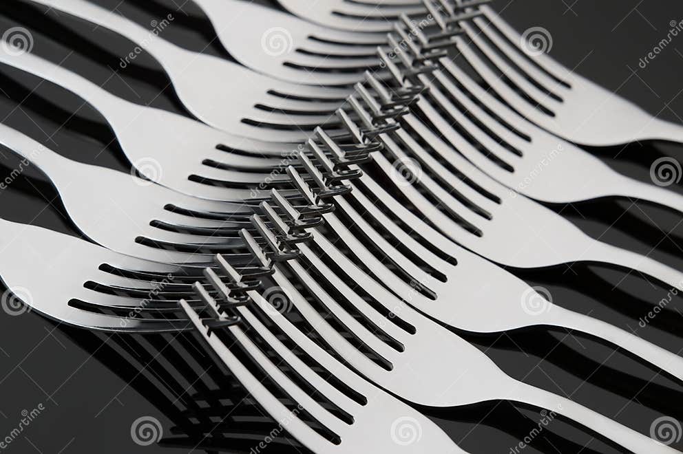 Pattern with Many Silver Forks on Black Mirror Background. Concept ...