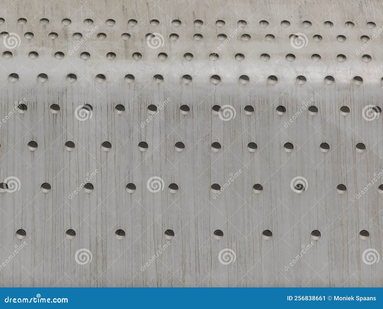 Pattern of Round Holes in a Grey Concrete Wall Stock Image - Image of ...