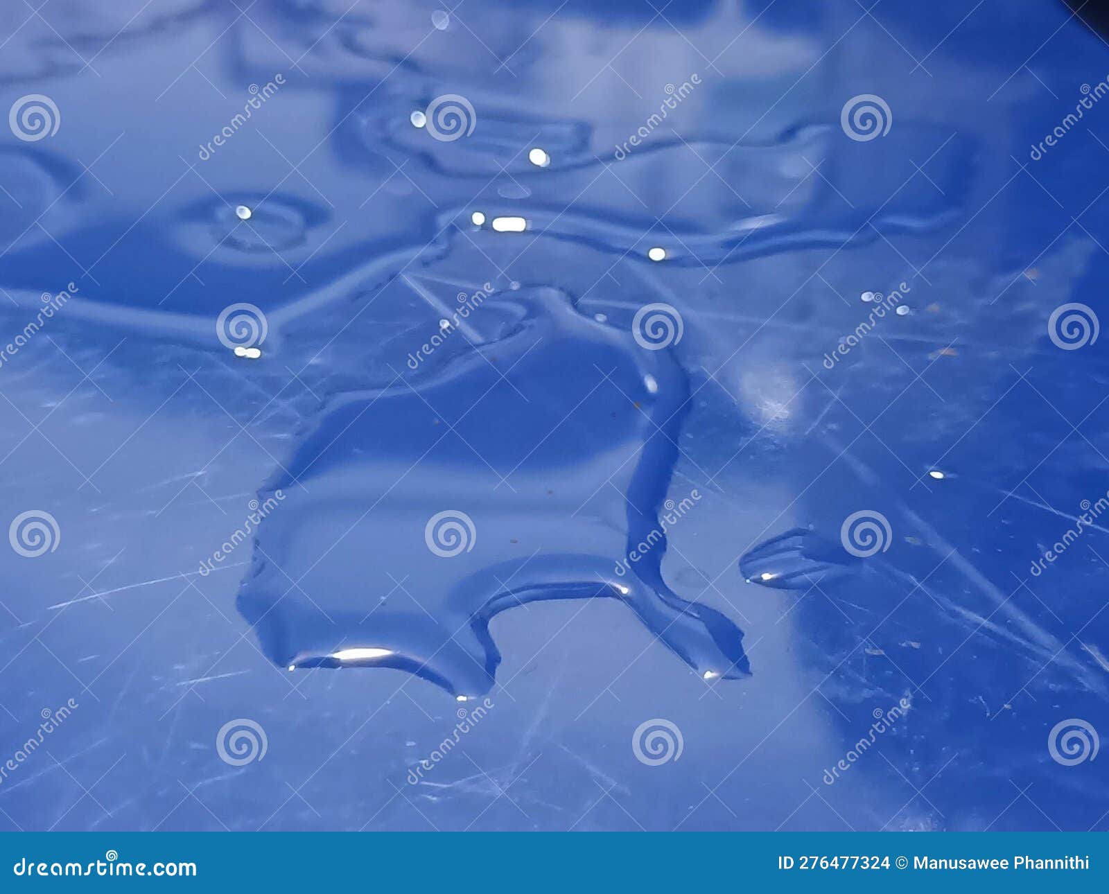 Pattern of Spilled Water on Blue Background Stock Photo - Image of ...
