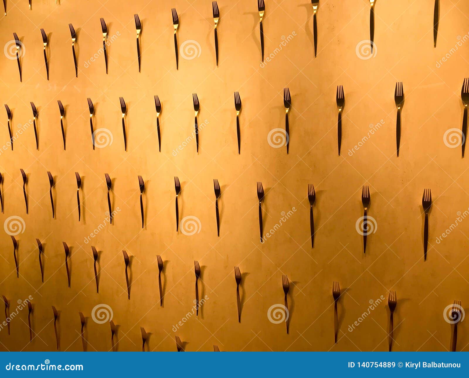 The Pattern of a Variety of Metal Forks, Cutlery on the Wall on a ...