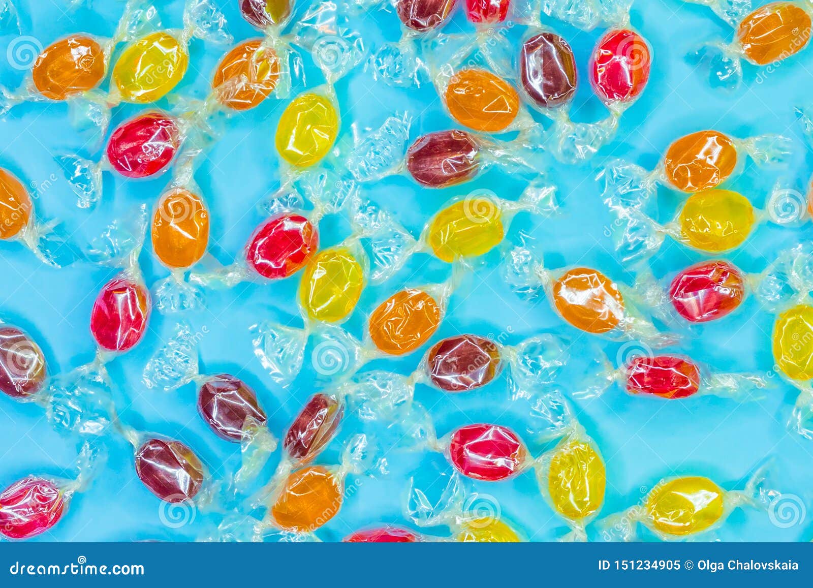 Pattern of a Variety of Multi-colored Candy on a Blue Background Stock ...
