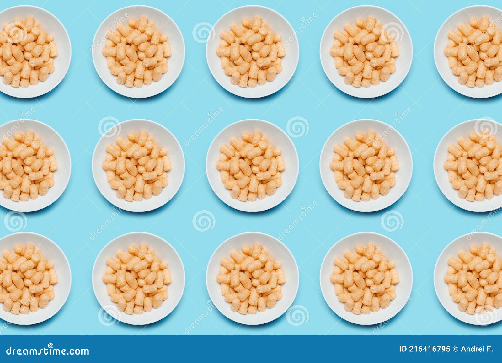 Pattern of White Bowls with Corn Puffs on Blue Background. Stock Image ...