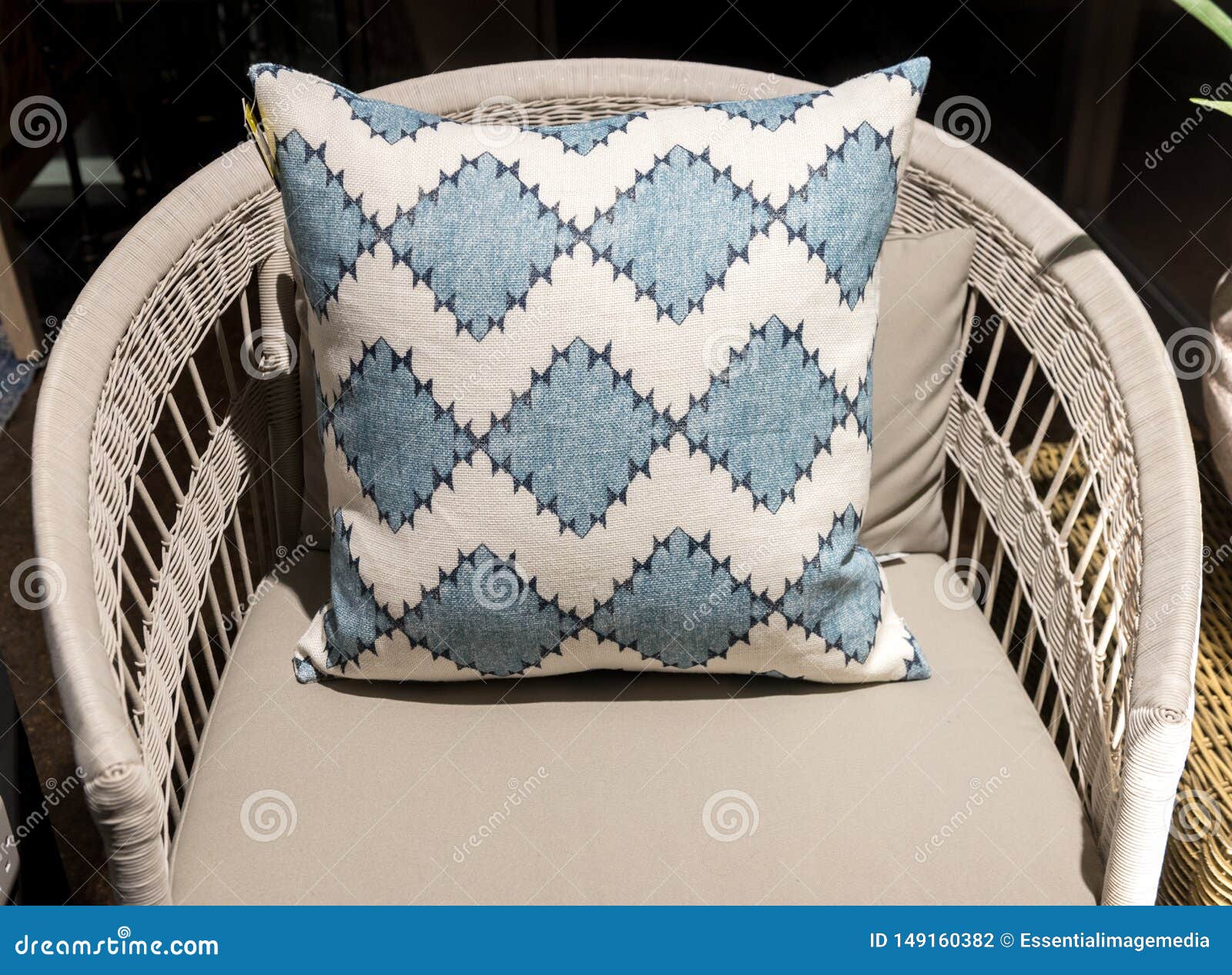 Patterned Cushion on Wicker Chair Stock Photo - Image of design, house ...