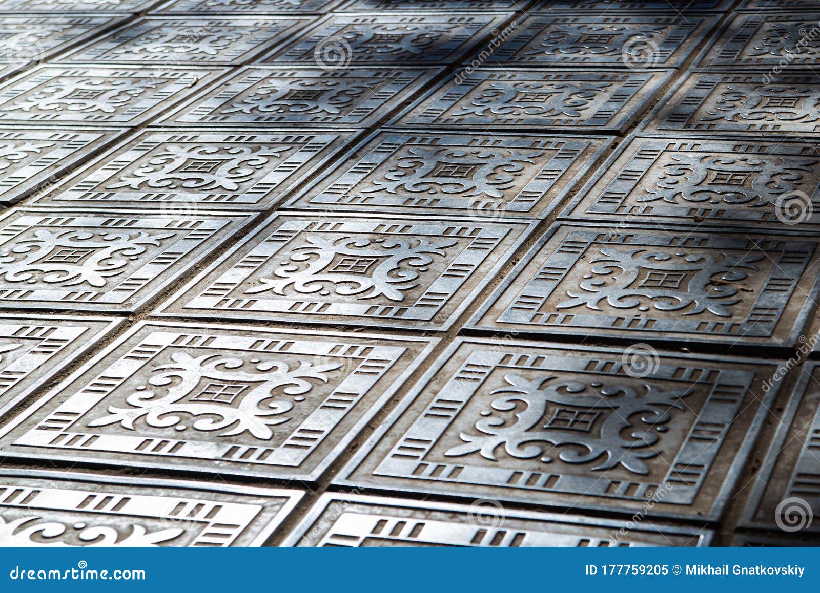 Patterns on Large Metal Floor Plates on a Street of City Stock Image ...