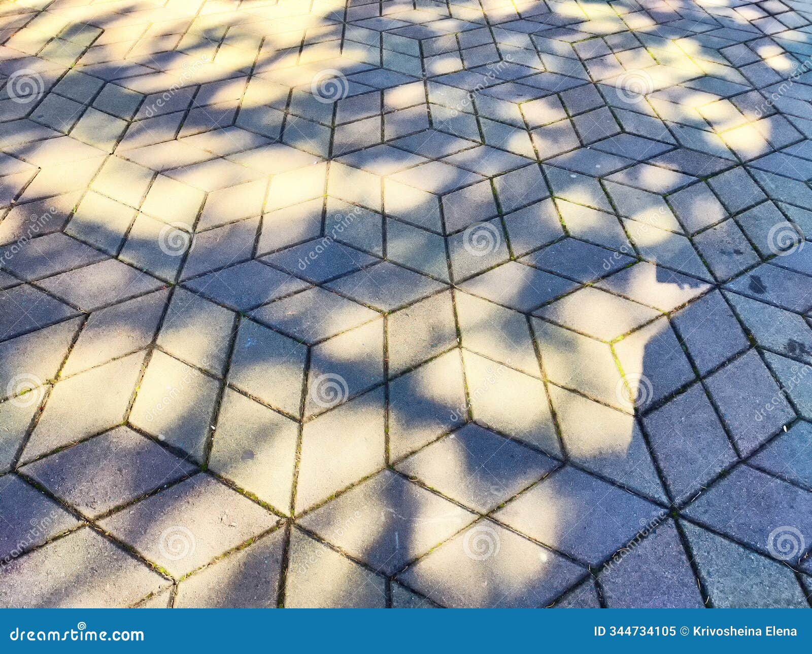 Patterns of Sunlight Creating Shadow Designs on Pavement in an Outdoor ...