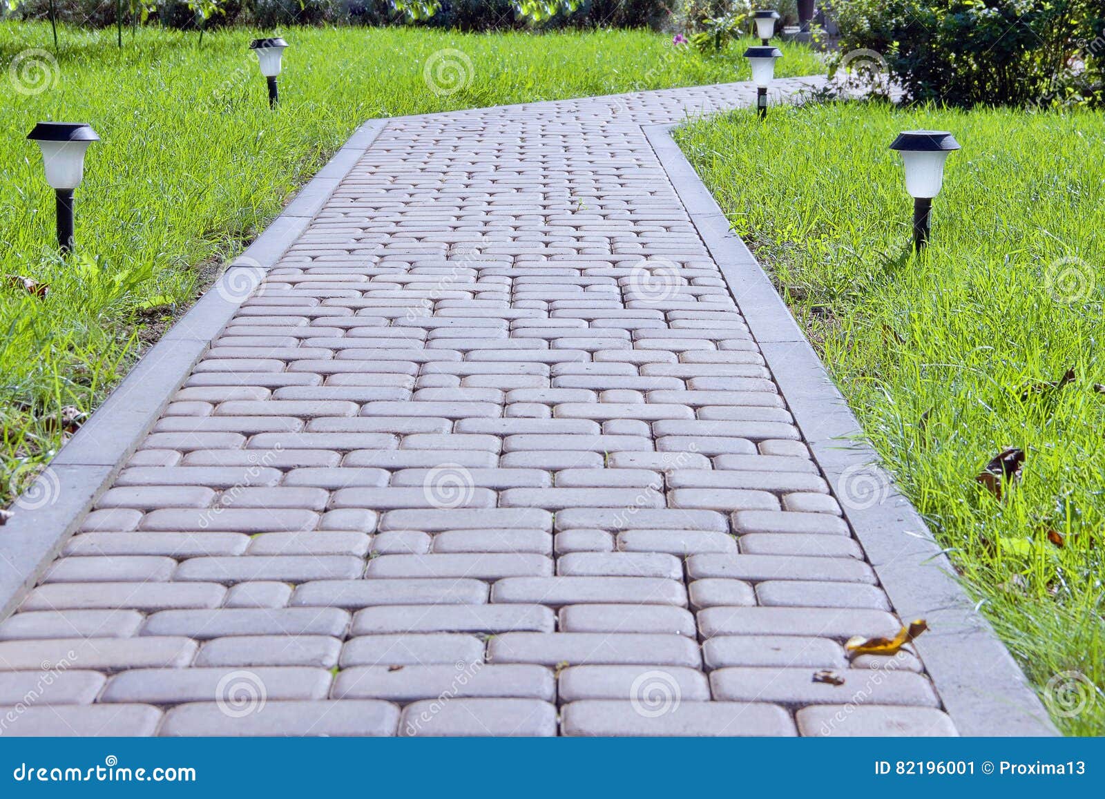 Paved Garden Path with Lanterns with Solar Batteries Stock Image ...