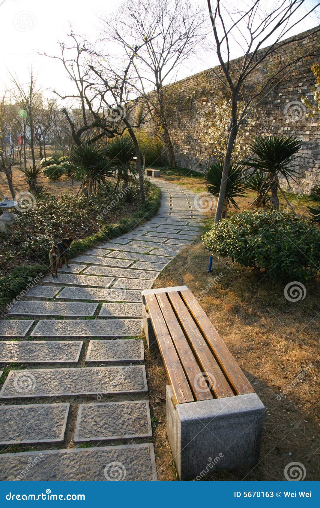 Paved path with bench stock image. Image of bench, stone - 5670163