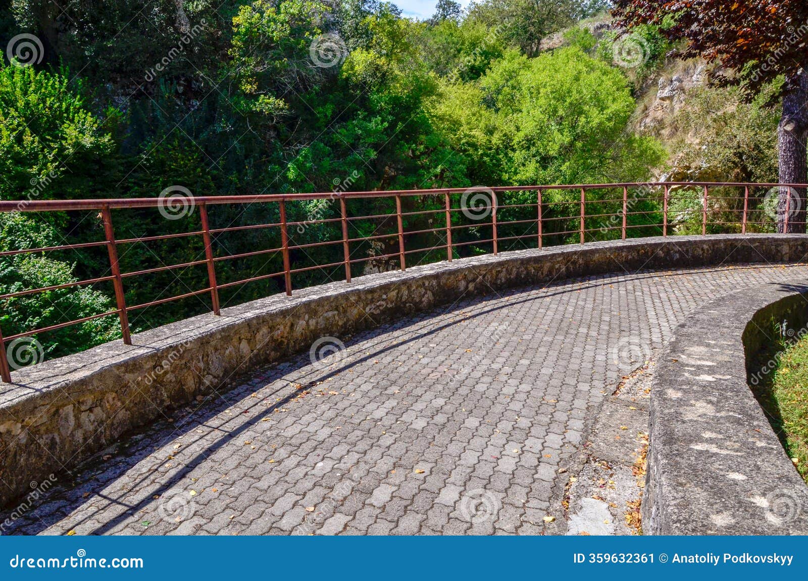 Paved Path with Railing in Park Setting Stock Image - Image of captures ...