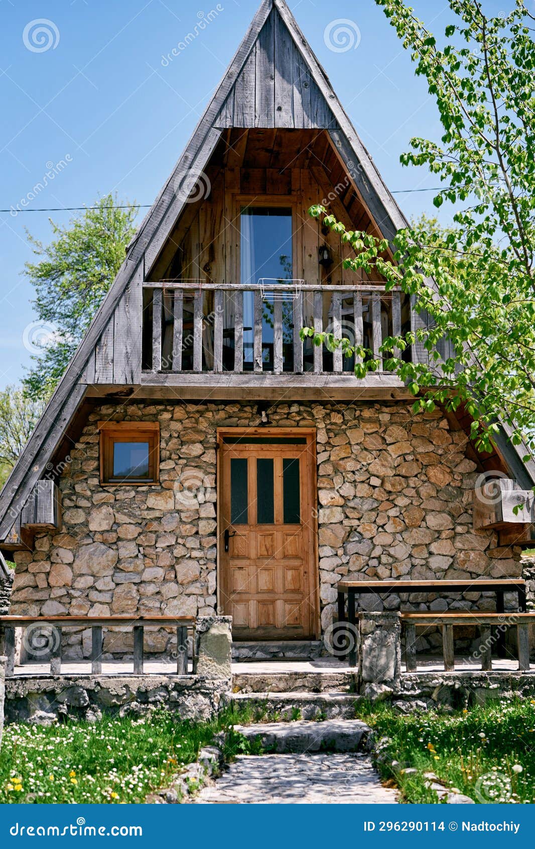 Paved Path To a Triangular Stone House in a Green Garden Stock Photo ...