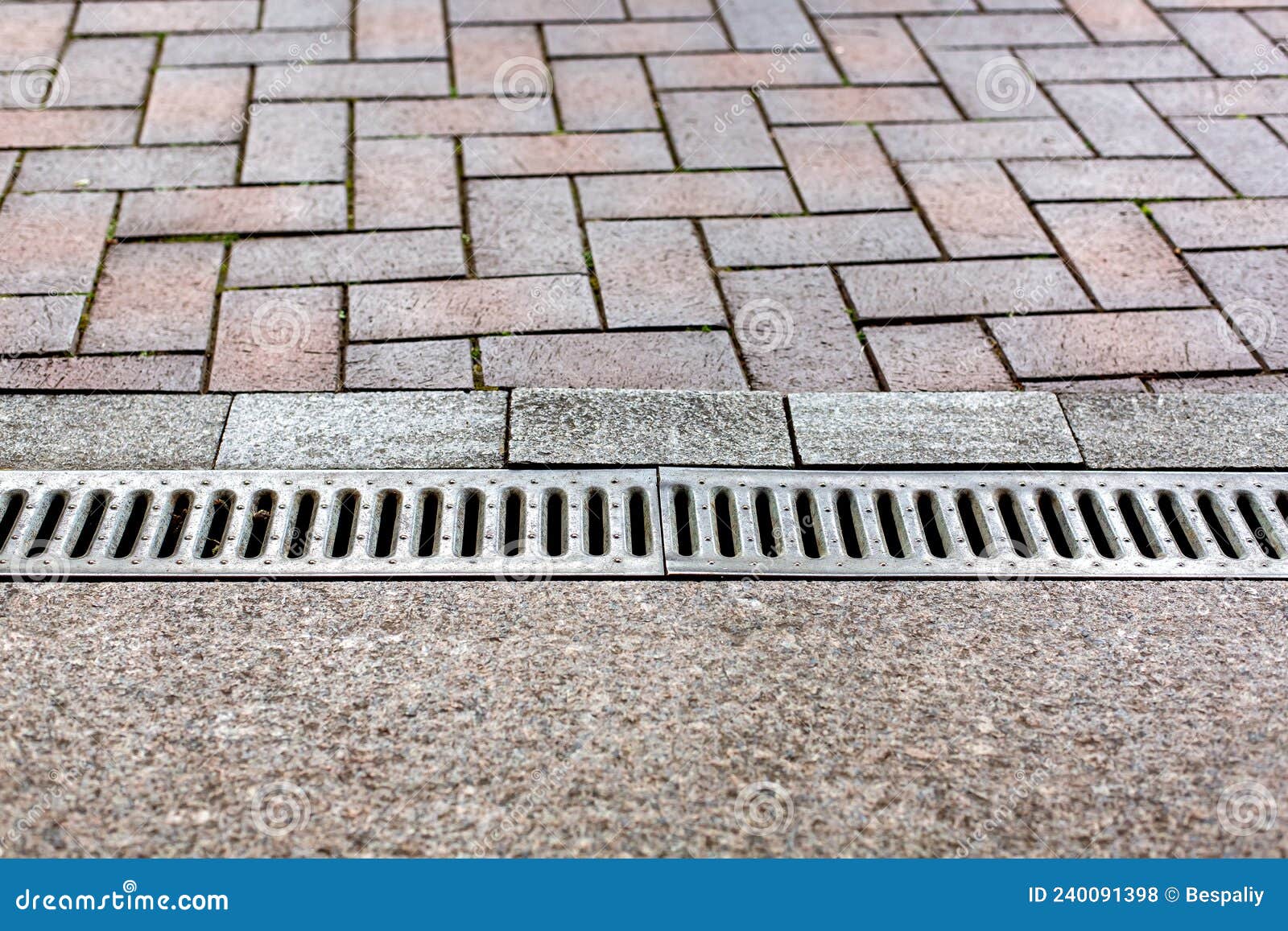 Pavement Drainage Grate with Line Iron Grill on Rectangular Mosaic Tile ...