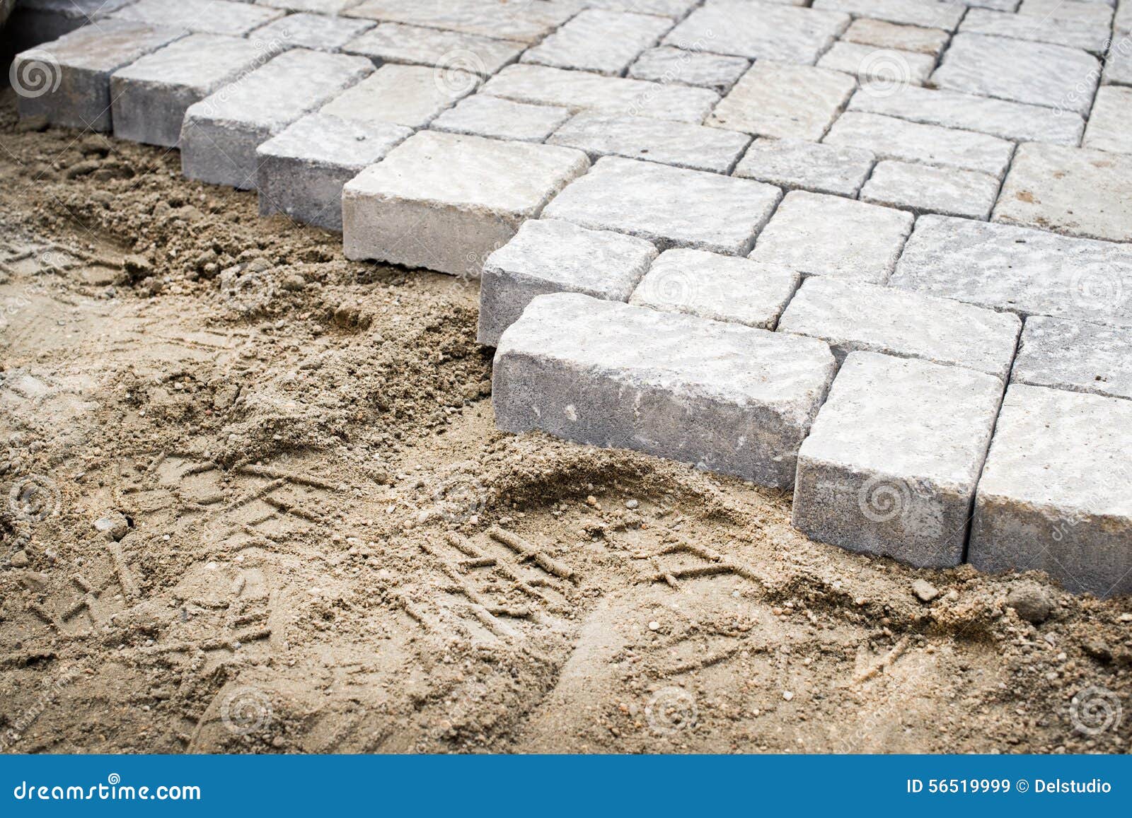 Pavement laying in a yard stock image. Image of cobblestone - 56519999