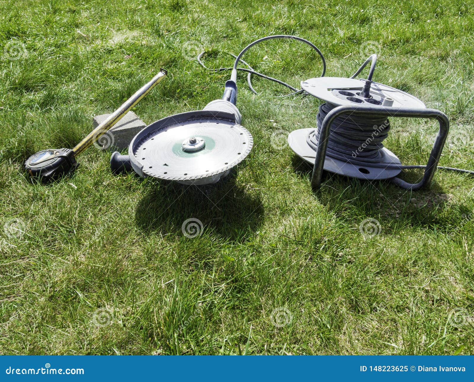 Pavement Stone are Laying on Grass. Work Tools, Measure Ruler and Saw ...