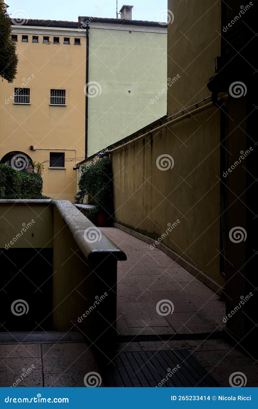 Pavement in a Yard and Descending Path To a Garage in the Shade Stock ...
