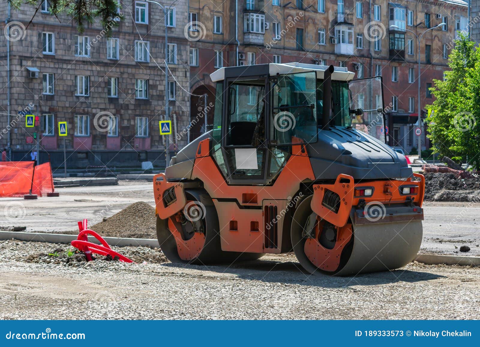 Paver in the Process of Leveling the Ground of the Road, for Road ...