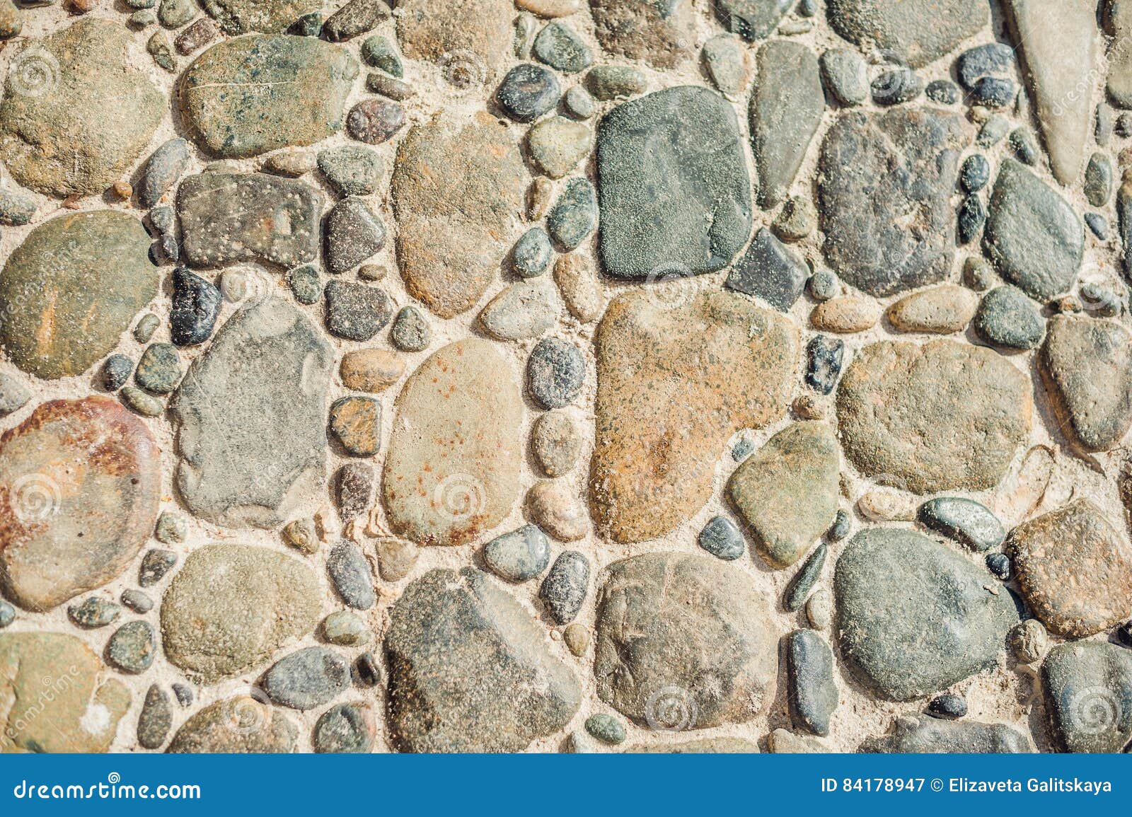 Paving Blocks Made of Round Stones and Concrete Path. Stock Image ...