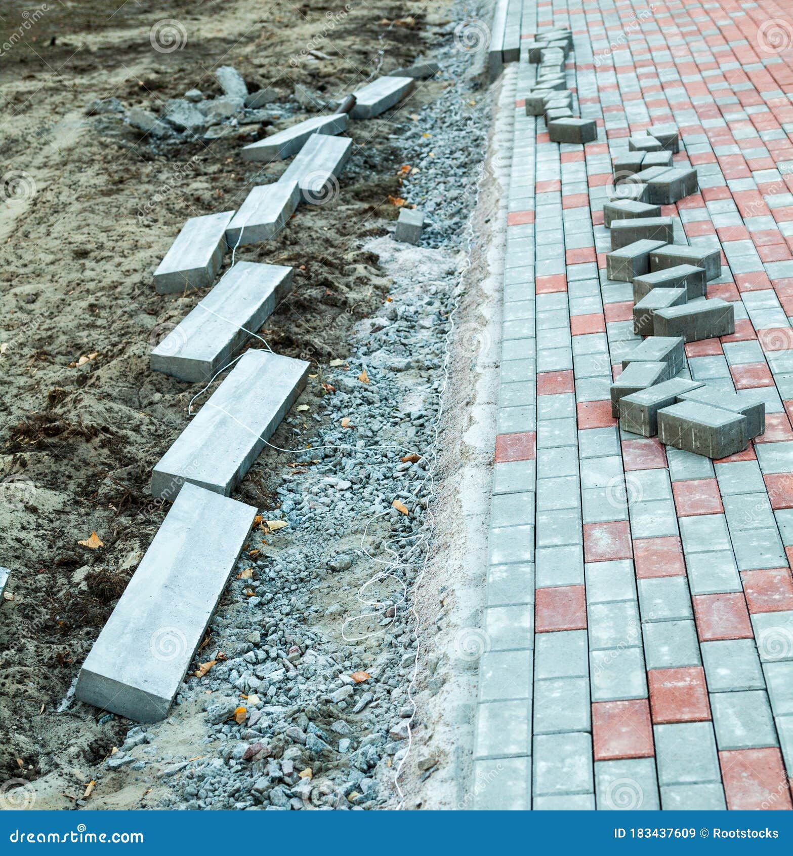 Paving the footpath stock image. Image of foot, material - 183437609