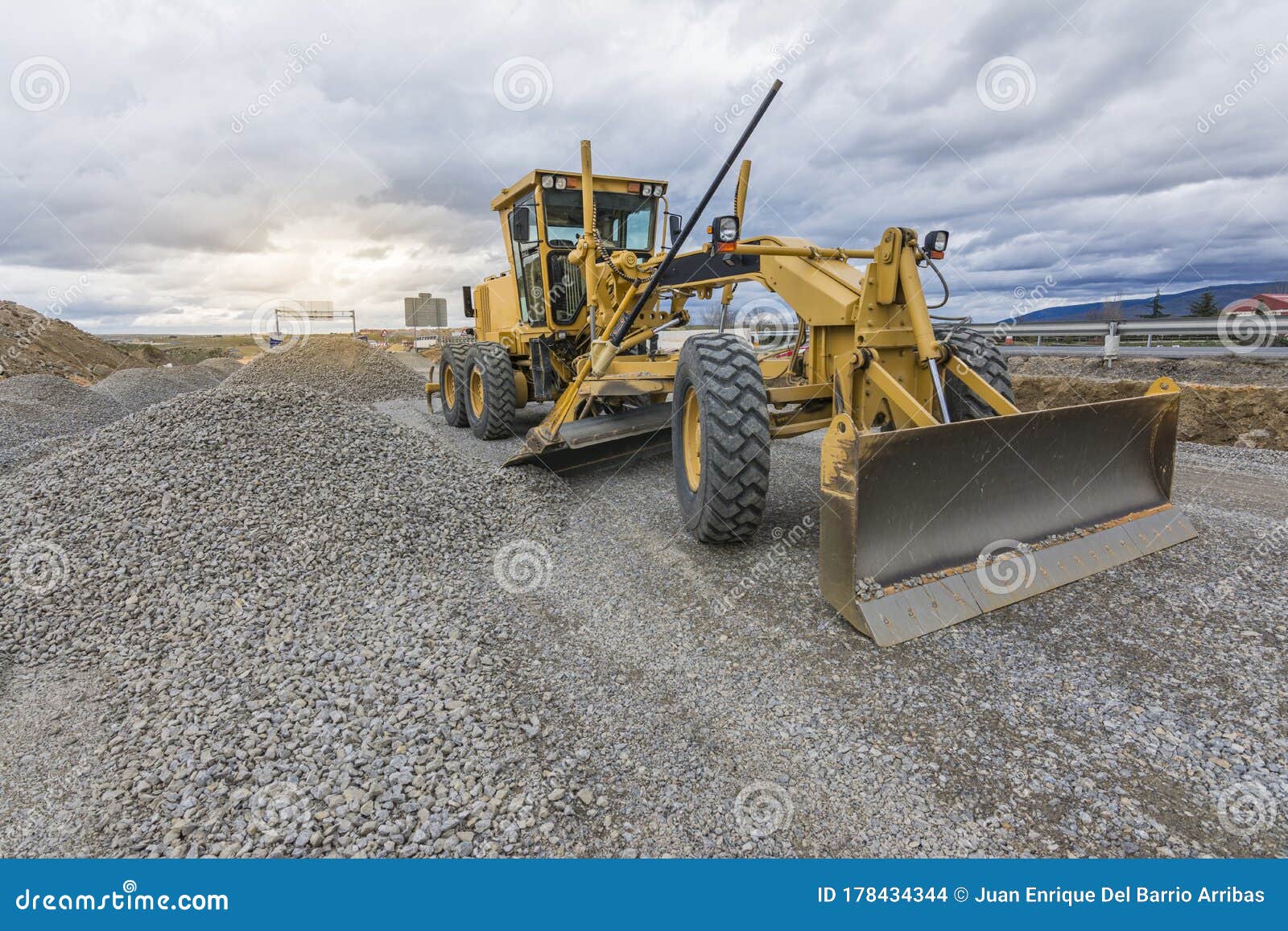 Paving the Ground at Road Construction Works with a Bulldozer Stock ...