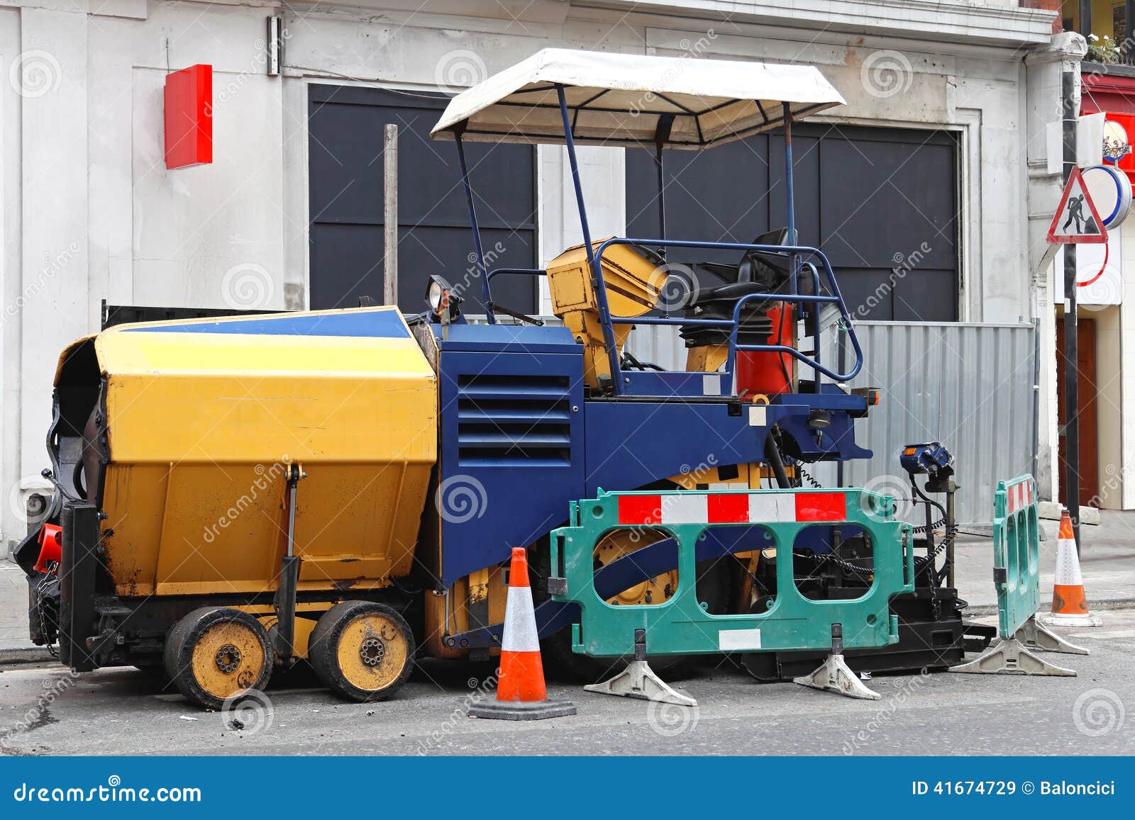 A Paving Machine Placing Fresh Asphalt Or Bitumen On A Gravel Base ...
