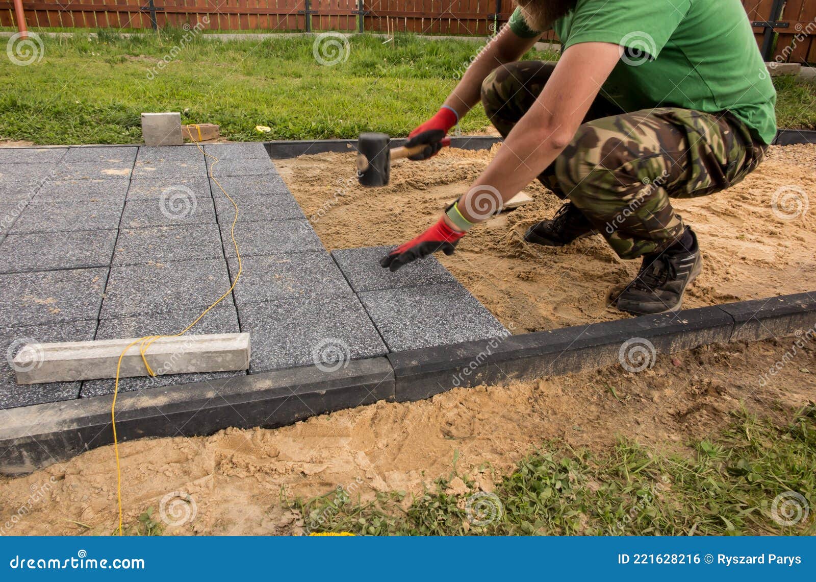 Paving a Pavement Made of Large Square Tiles Stock Photo - Image of ...