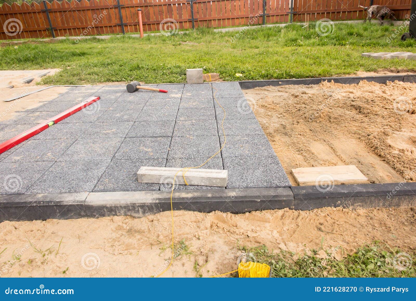 Paving a Pavement Made of Large Square Tiles Stock Photo - Image of ...