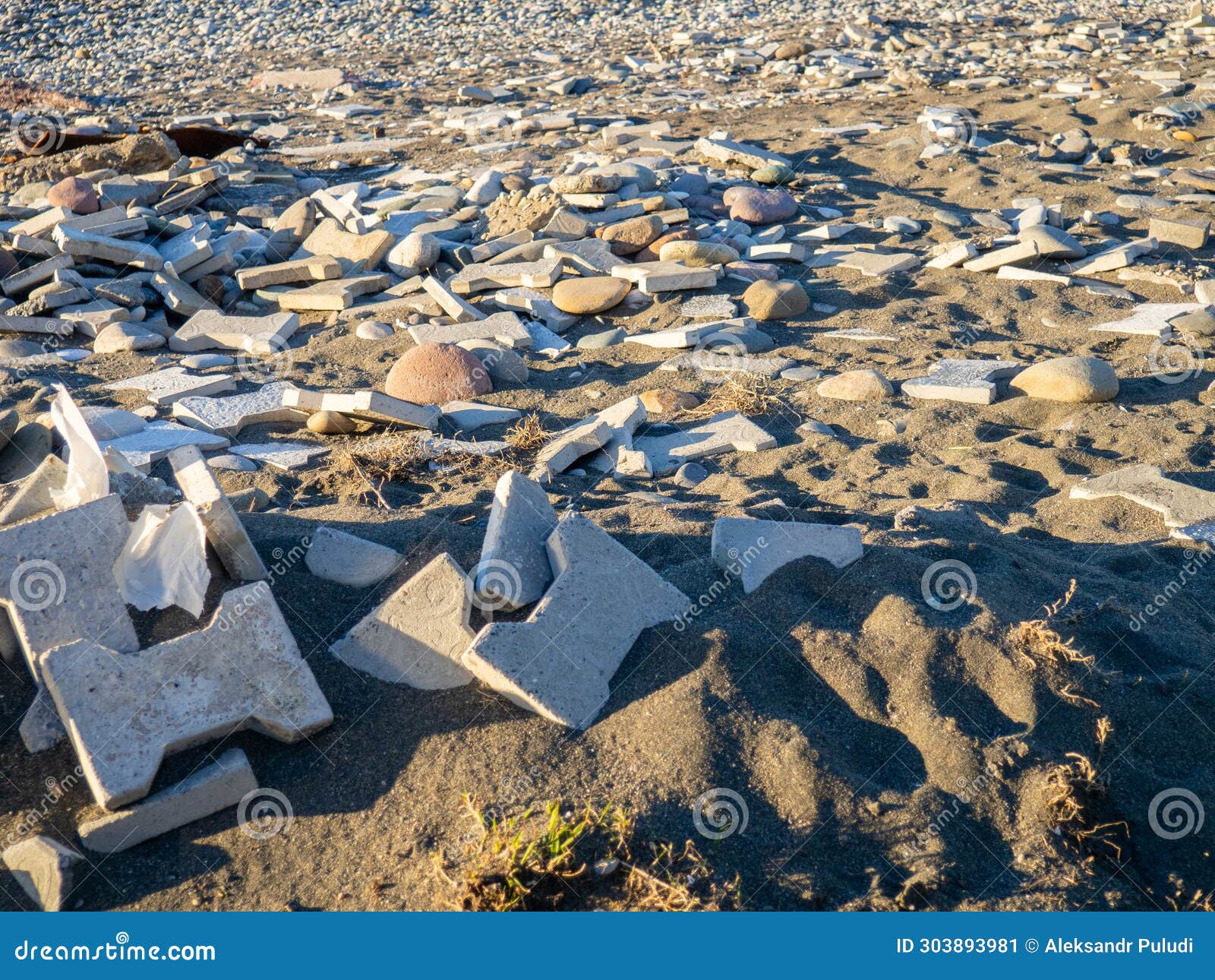 Paving Slabs are Scattered on the Sand. Embankment after the Storm ...