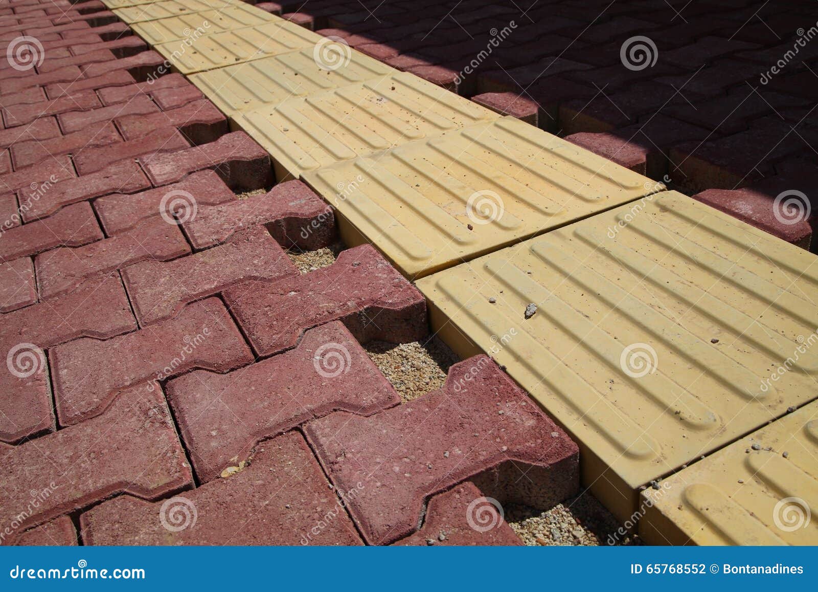 Paving Tiles On A Sidewalk With Underground Water Drainage Culvert ...