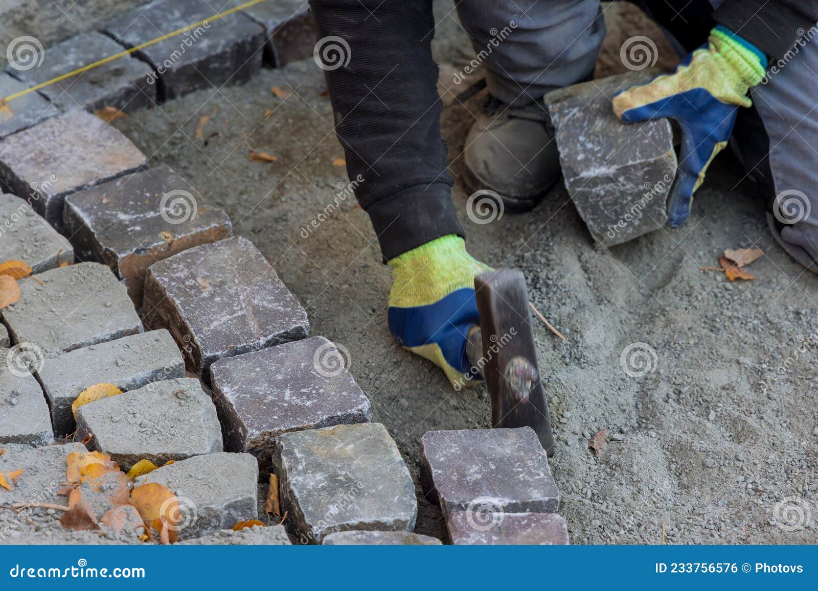 Paving Worker Using Hammer Pavement with Granite Stones Cobblestones ...