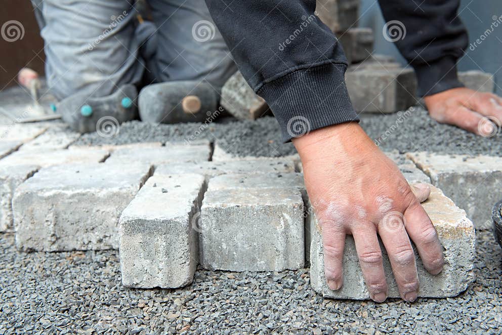 Pavior stock photo. Image of hand, pavement, concrete - 40558610