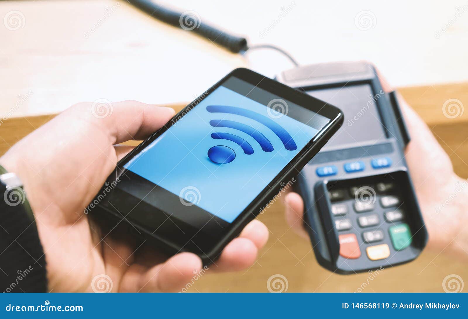 Pay by Smartphone through the Terminal. Man with Smartphone Mobile ...