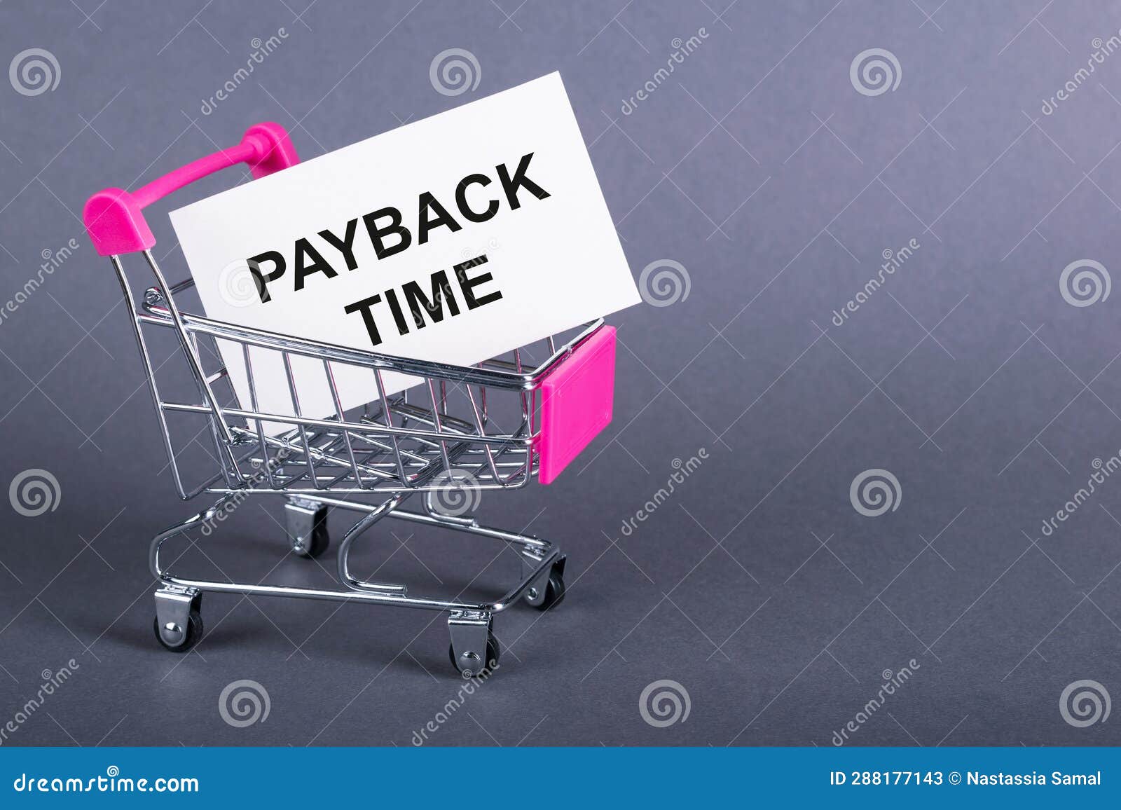 PAYBACK TIME Text on Sticky in Mini Shopping Trolley Stock Image ...