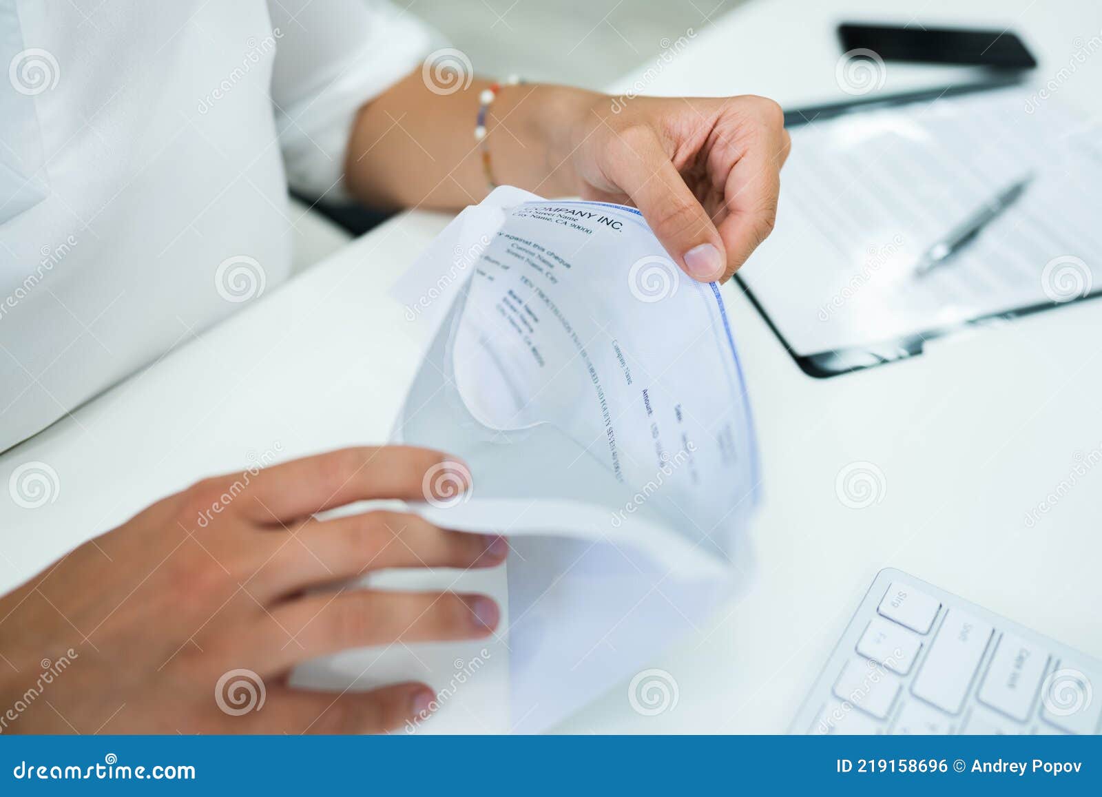 Paycheck in Open Envelope stock photo. Image of female - 219158696
