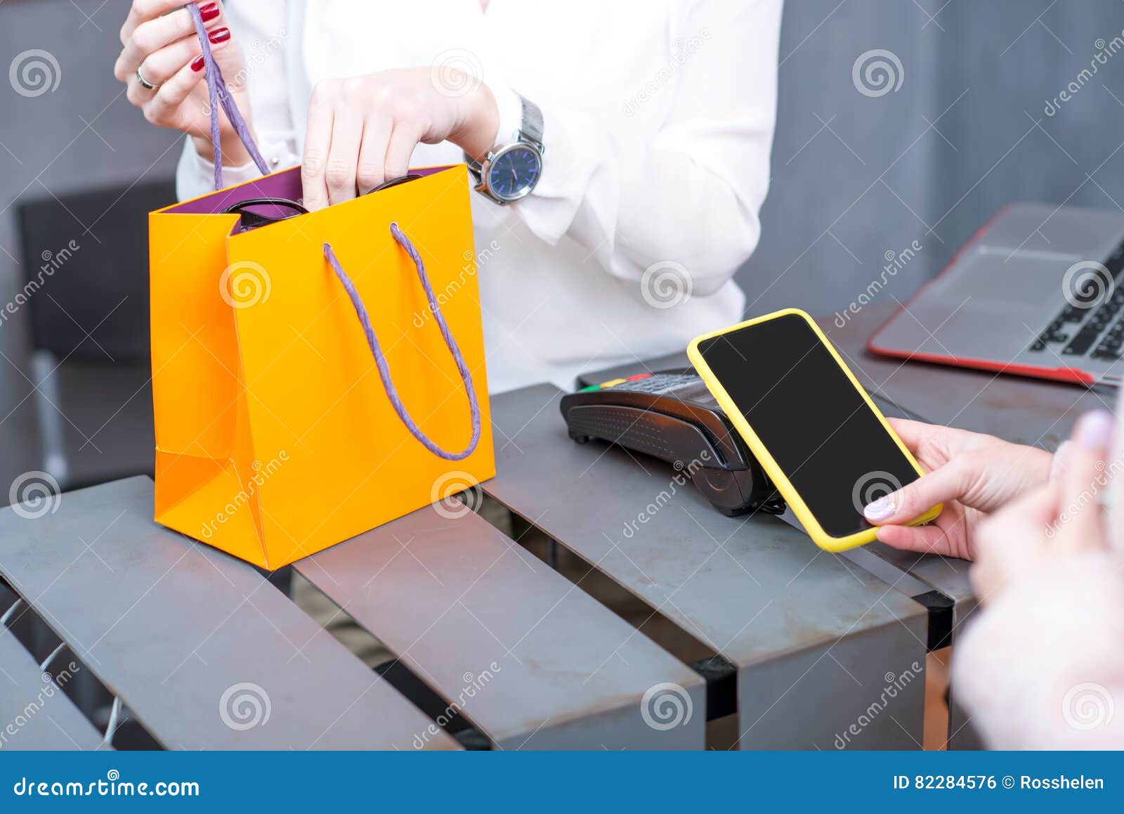 Paying with mobile phone stock photo. Image of female - 82284576