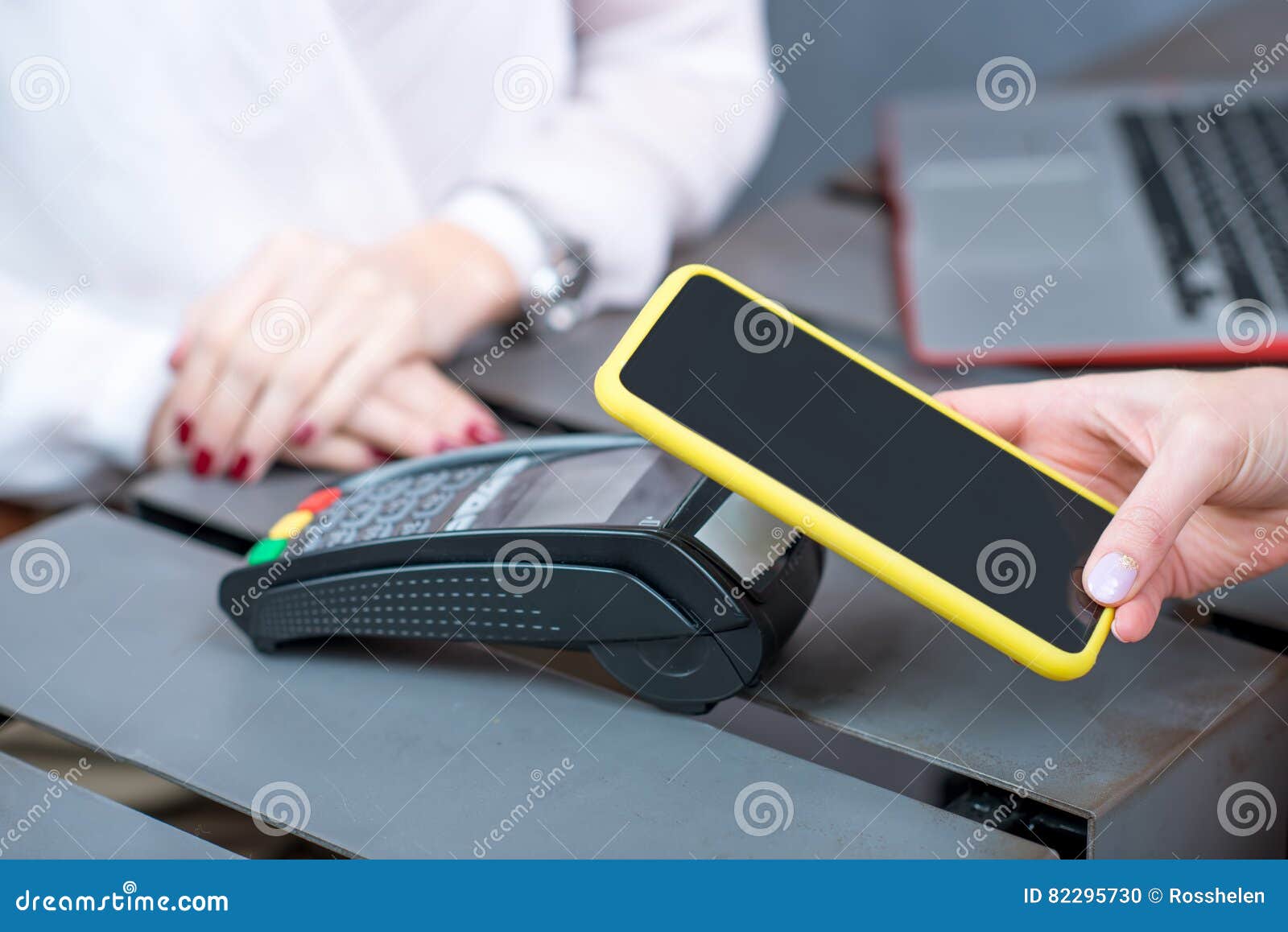 Paying with mobile phone stock photo. Image of transaction - 82295730