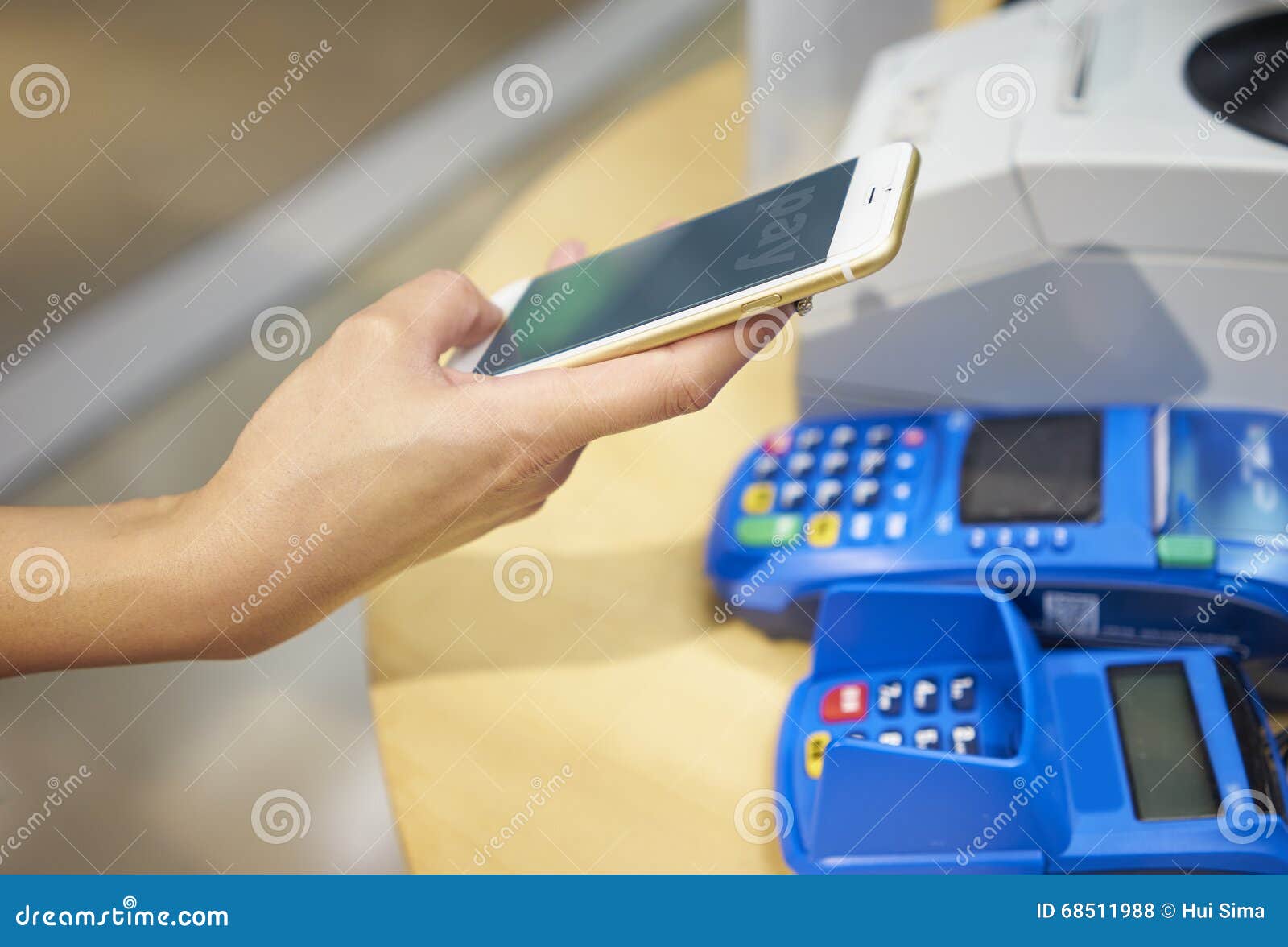 Paying with mobile phone stock photo. Image of buyer - 68511988