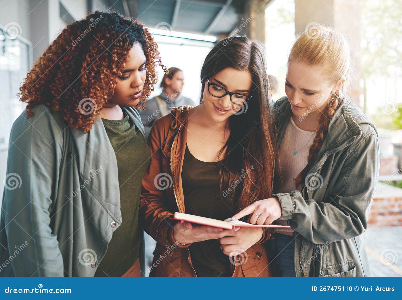 It Pays To Share the Knowledge. a Group of Young Students Reading a ...