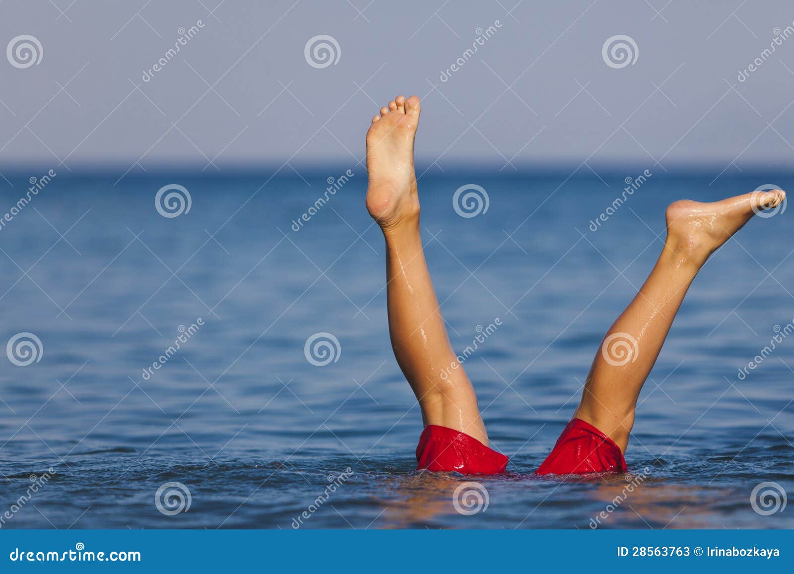Diving. Legs In Black Rubber Wetsuit And Flippers Stock Photography ...