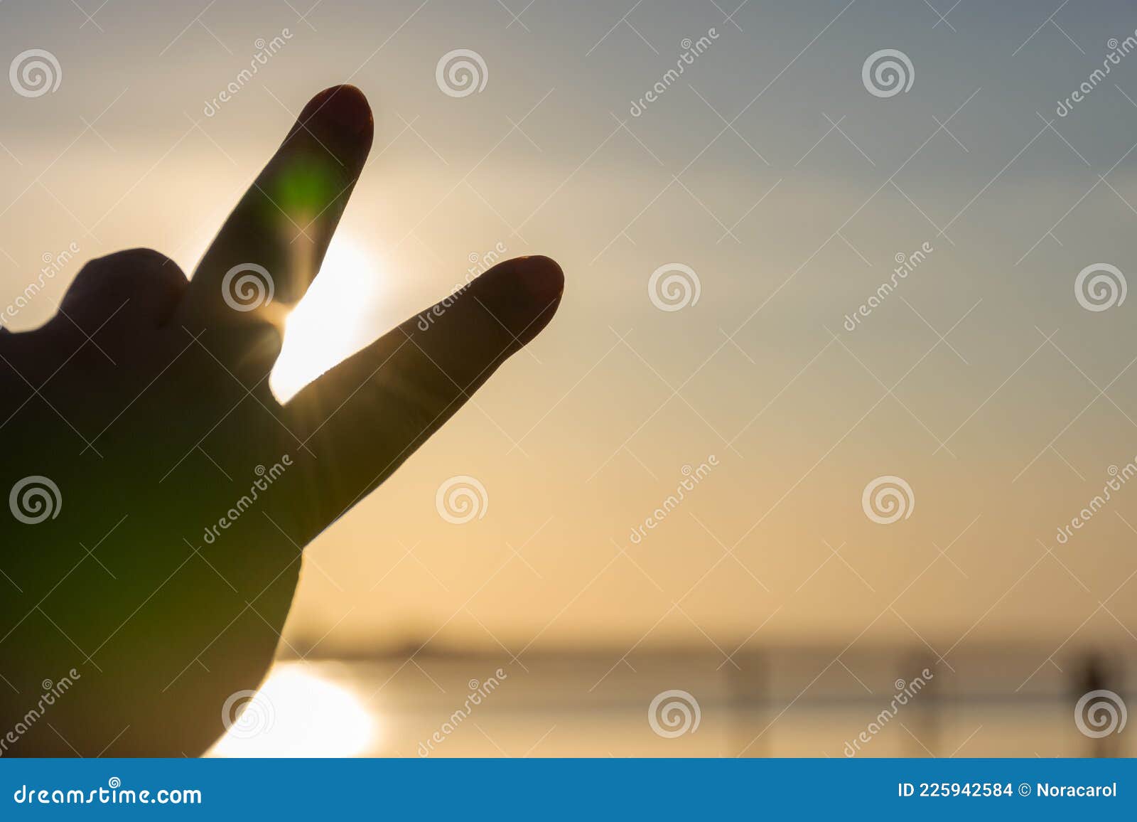 Peace sign at sunset stock photo. Image of communication - 225942584