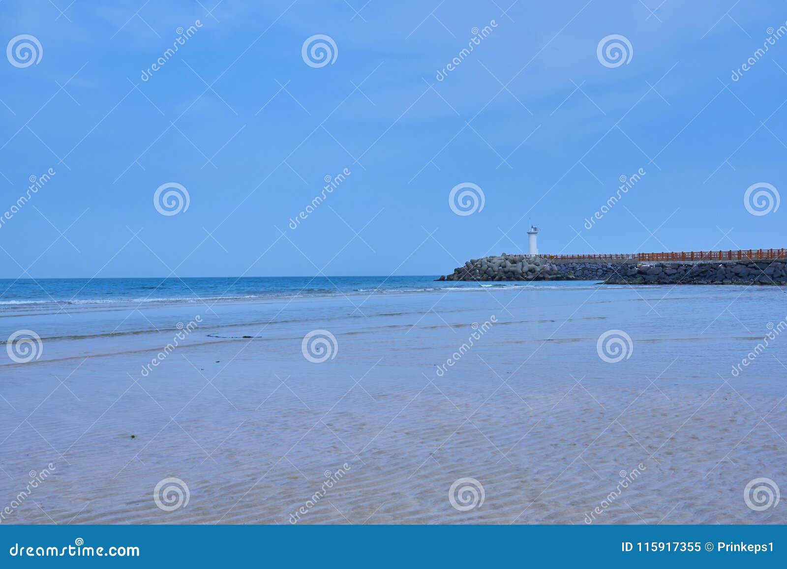Beach with White Lighthouse on Rocky Platform in Jeju Island. Stock ...