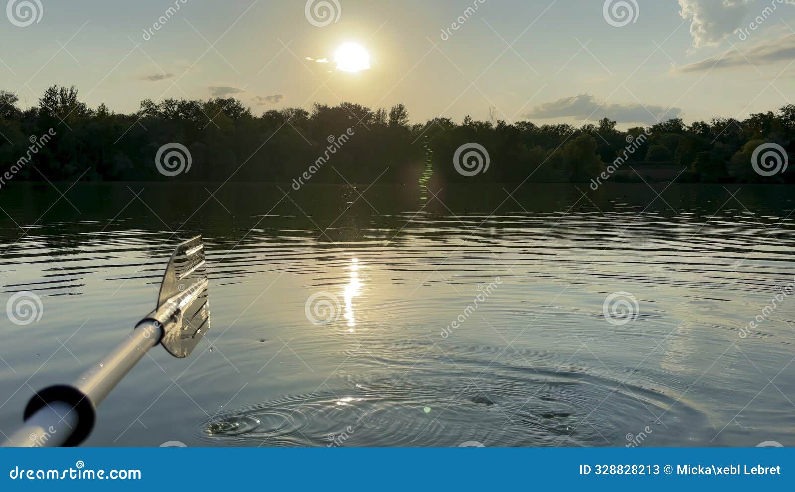 Peaceful Evening Rowing on Calm Lake at Sunset with Reflection of ...