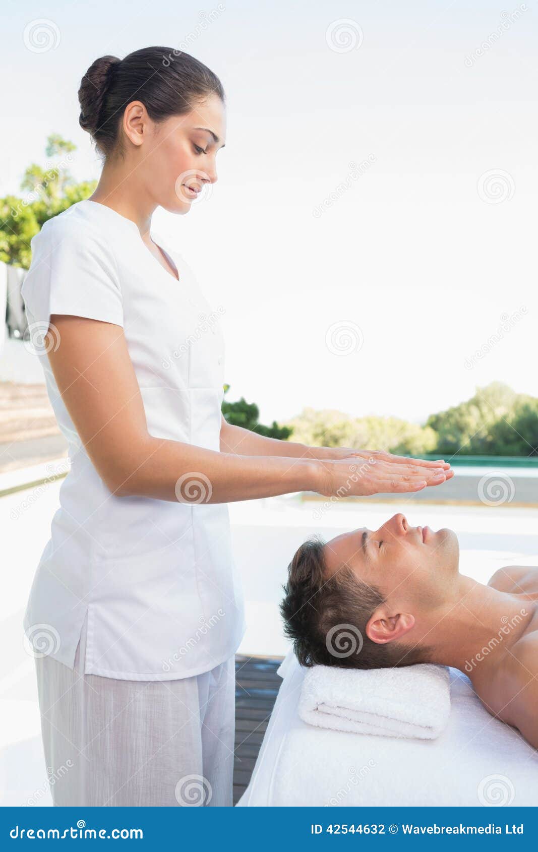 Peaceful Man Getting Reiki Treatment Poolside Stock Photo - Image of ...