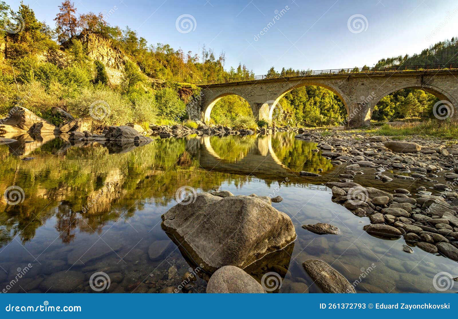 Peaceful River with Water Reflection and Old Stone Bridge Stock Image ...