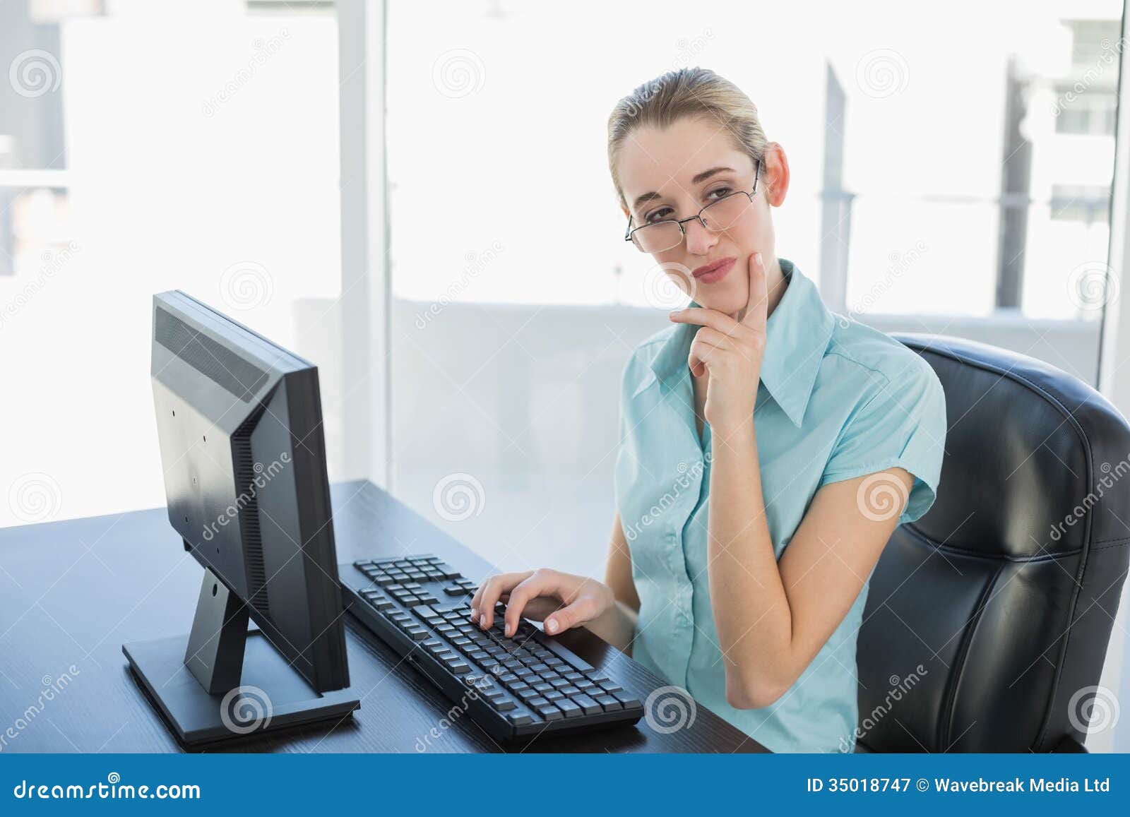 Peaceful Thinking Businesswoman Working on Her Computer Stock Image ...