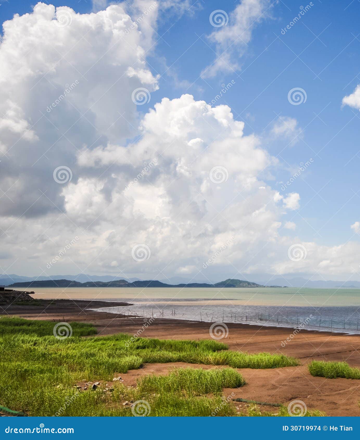 Peaceful View of Cloudscape Over Shallow Beach Stock Photo - Image of ...