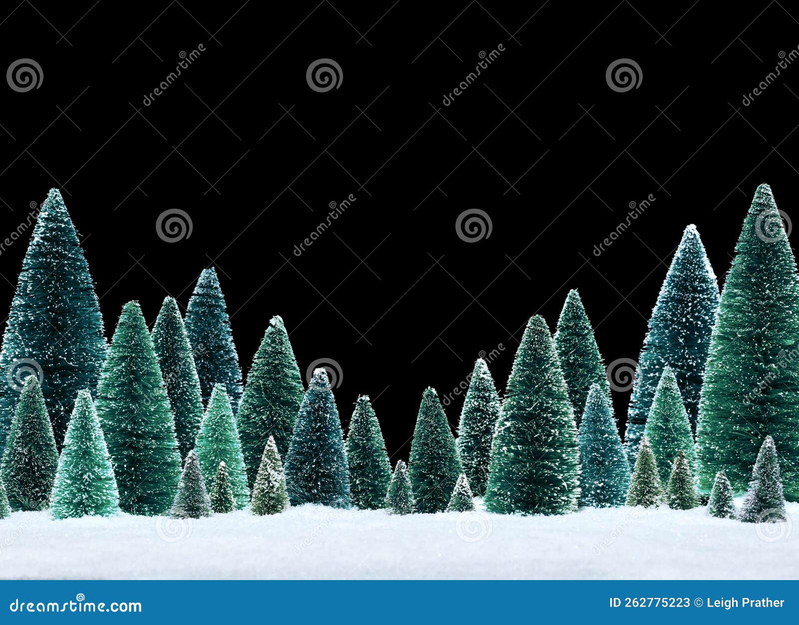 Peaceful Winter Scene with Miniature Snow Covered Trees on Glittering ...