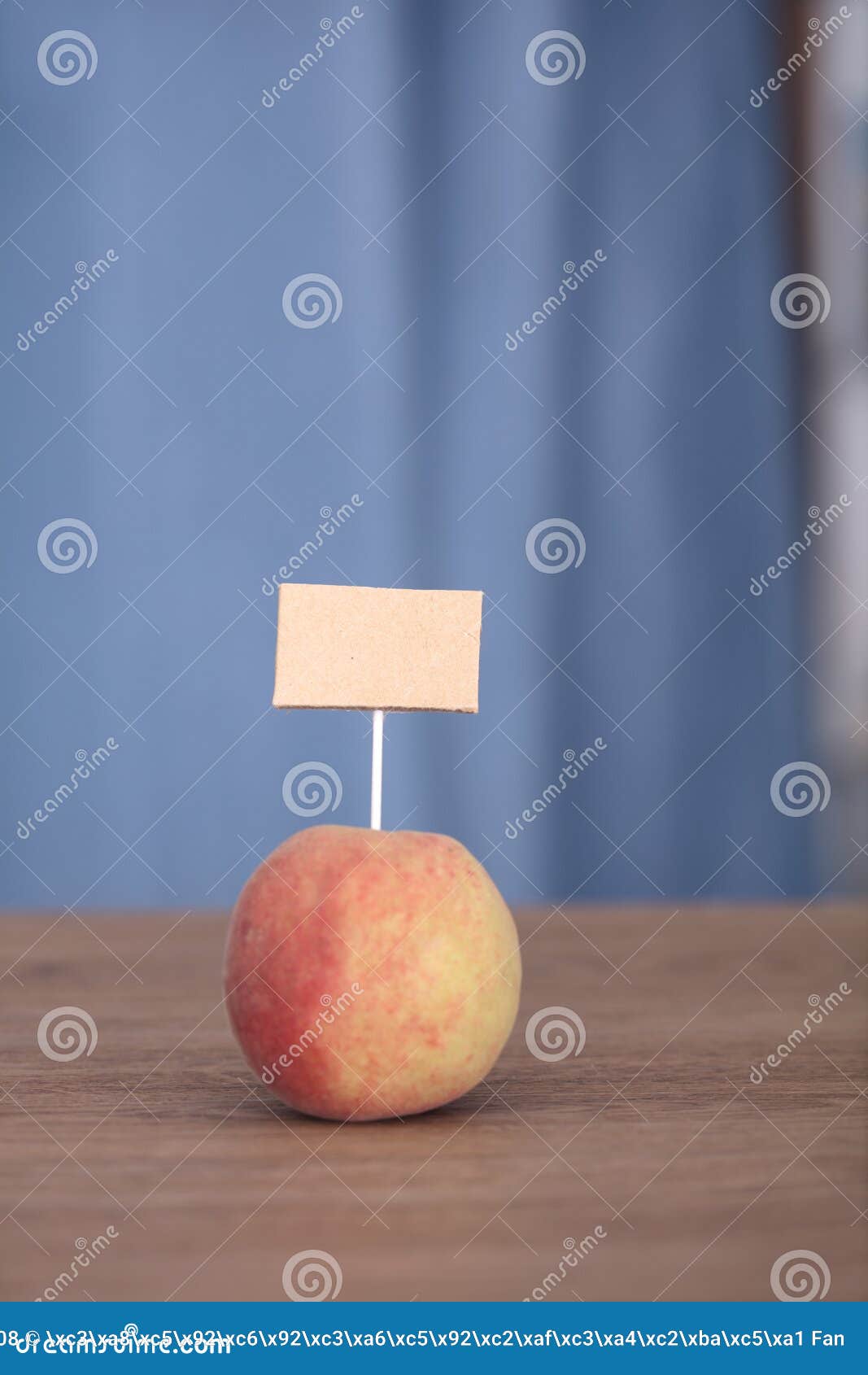 A peach with a price tag stock photo. Image of indoor - 253702508