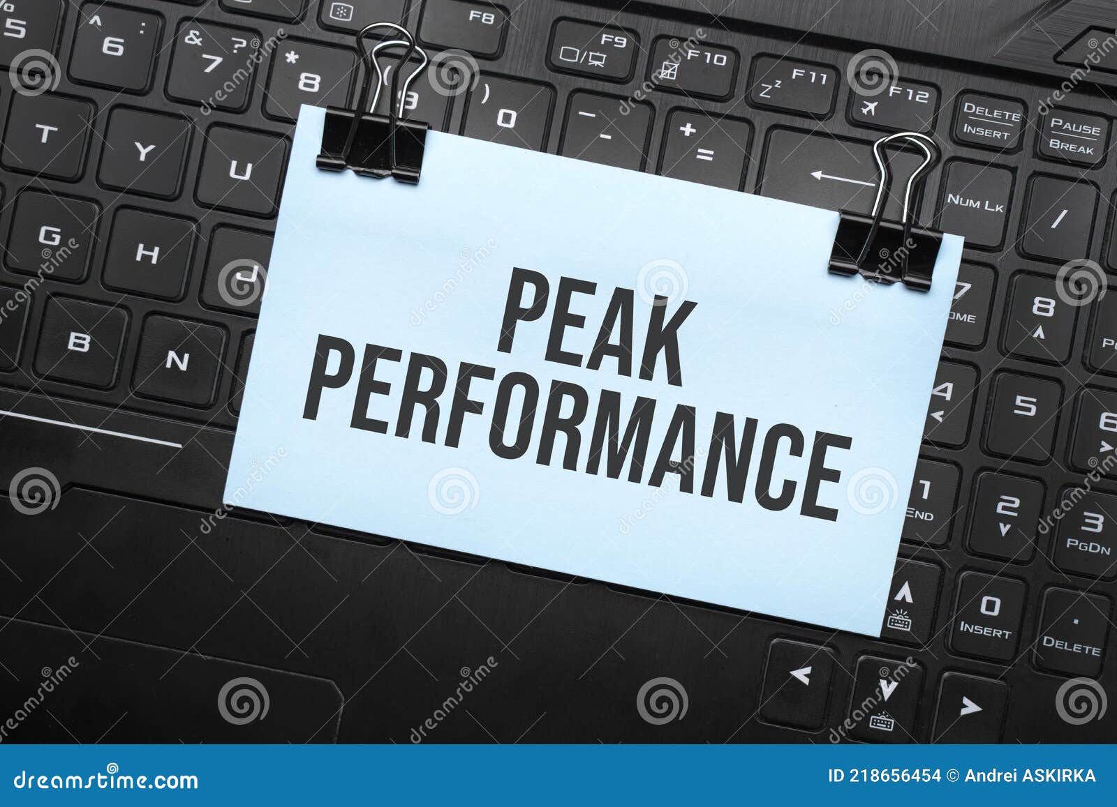 PEAK PERFORMANCE Inscription on White Paper Note on Laptop Keyboard ...