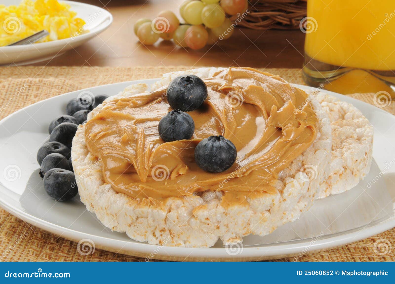 Peanut Butter and Blueberries on Rice Cakes Stock Photo - Image of ...