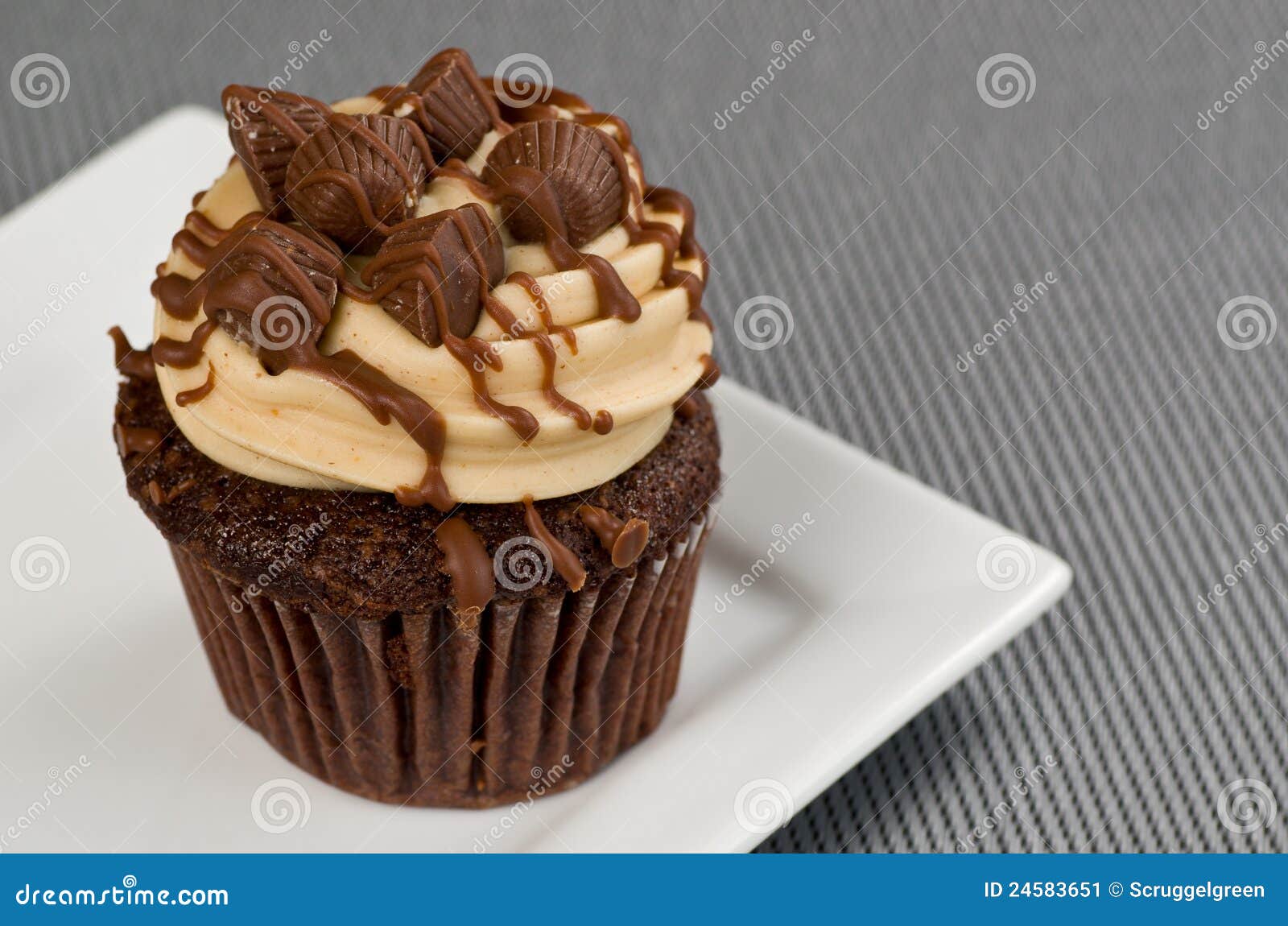 Peanut Butter Cupcake on Grey Stock Image - Image of drizzle, sweet ...