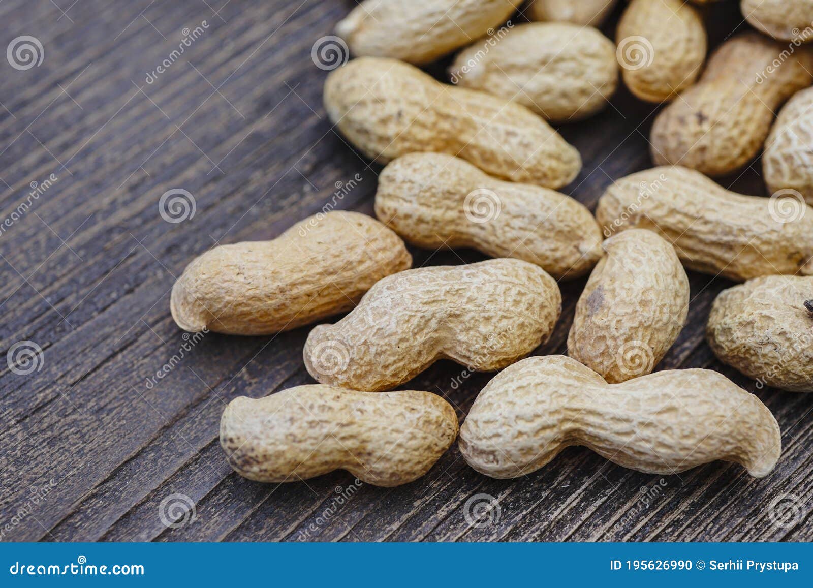 Peanut Grain in Peel on Wooden Background Stock Photo - Image of ...